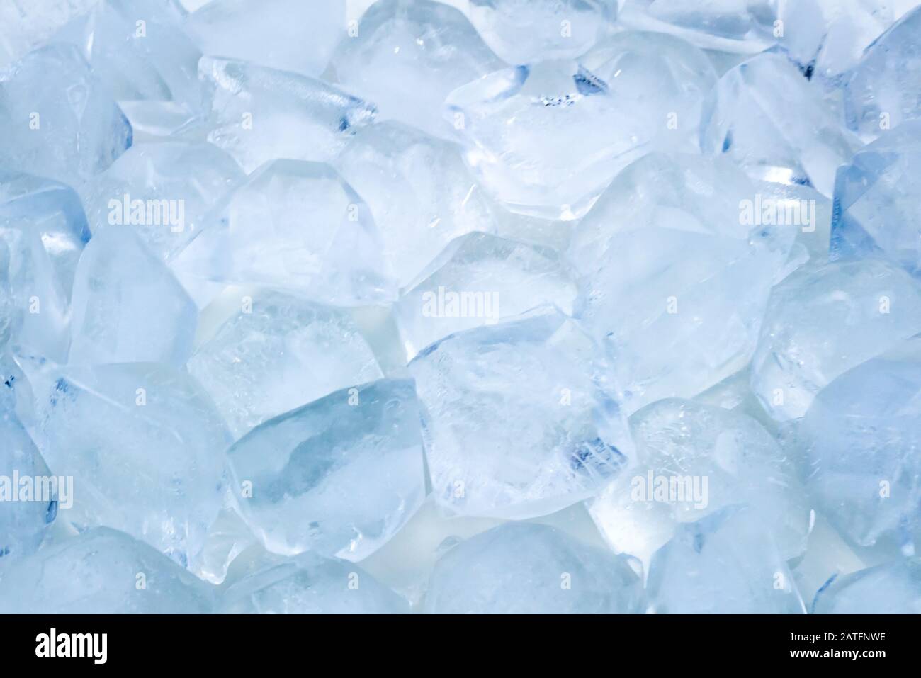 Ice cubes background texture with soft blue glowing Stock Photo - Alamy
