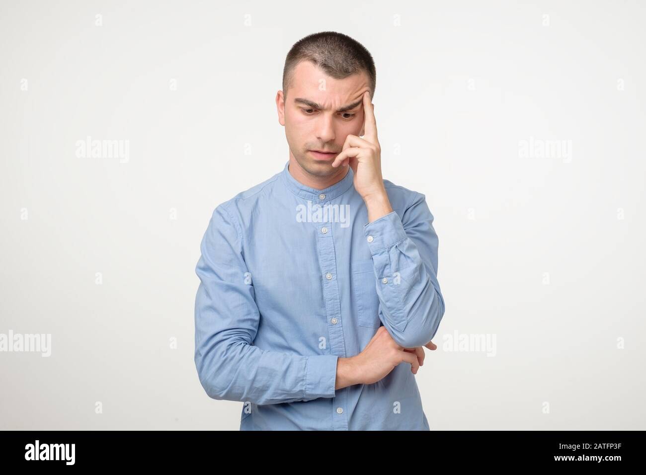 Hispanic thinking serious worried hi-res stock photography and images ...