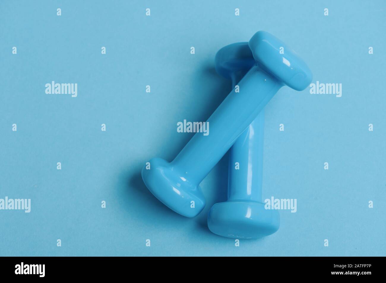 Barbells in small size, top view and copy space. Health regime and ...