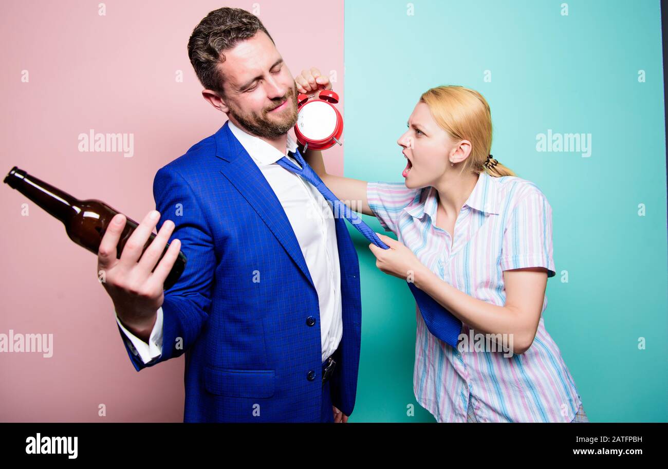 It is too late. Angry wife meeting drunk husband late at home. Man ...