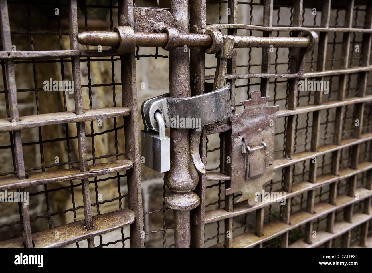 Old metal gate with lock, old metal door Stock Photo - Alamy