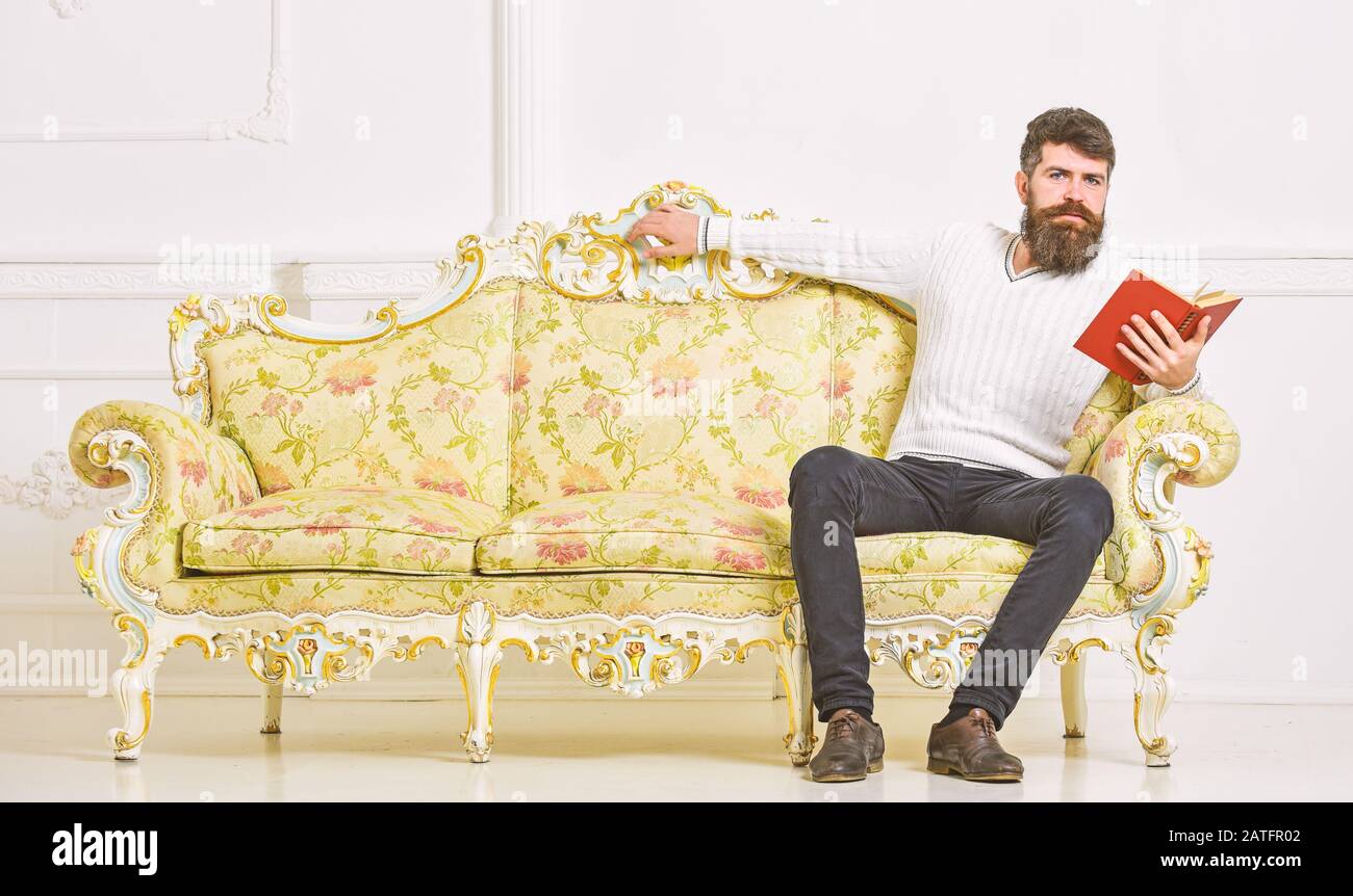 Self education concept. Macho on calm face reading book, studying. Man ...