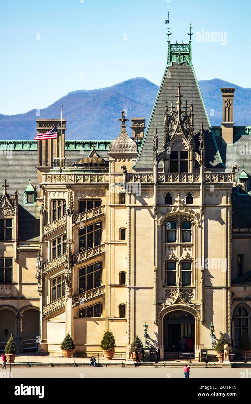 The Blue Ridge mountains loom behind the Biltmore House's entrance ...
