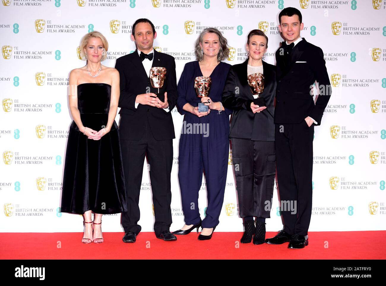 Gillian Anderson and Asa Butterfield pose for a photo with Mark Jenkin ...