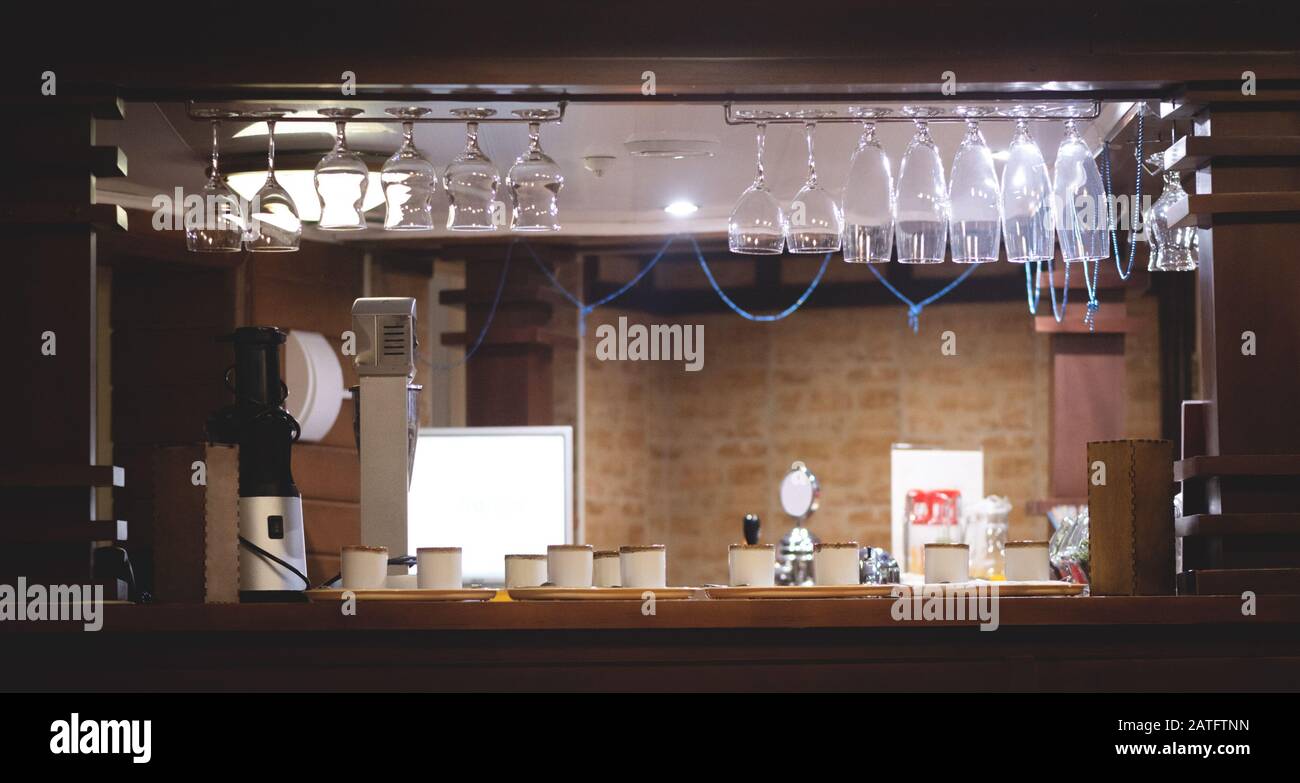 Bar counter abstract background with wine glasses hanging above Stock ...