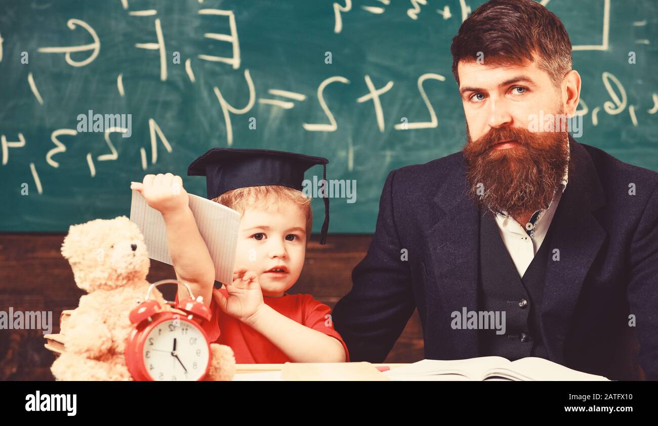 Father with beard, teacher teaches son, kid boy. Teaching kid concept ...