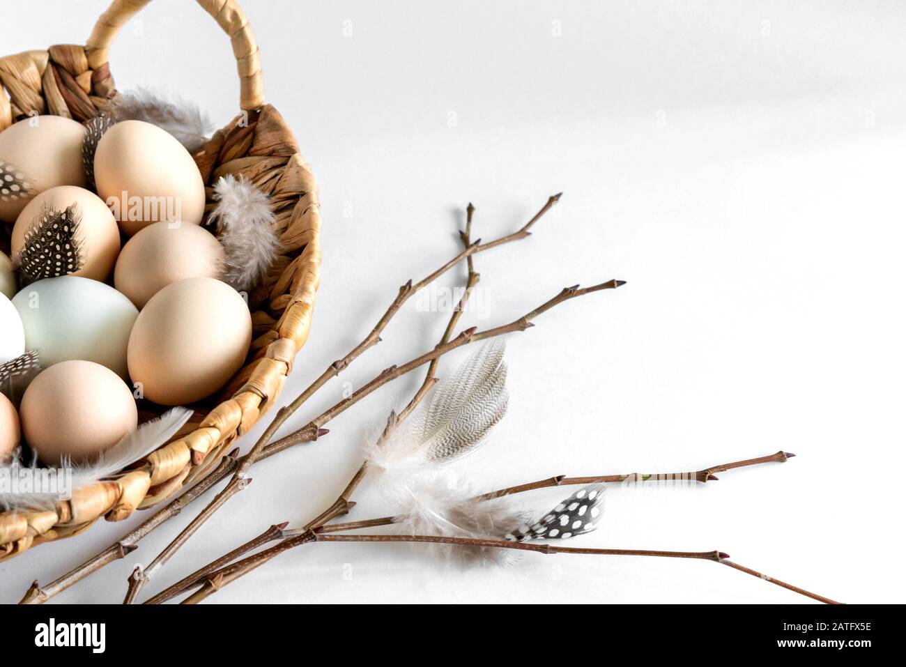 Fresh raw farm organic chiken eggs in a basket on whita background ...
