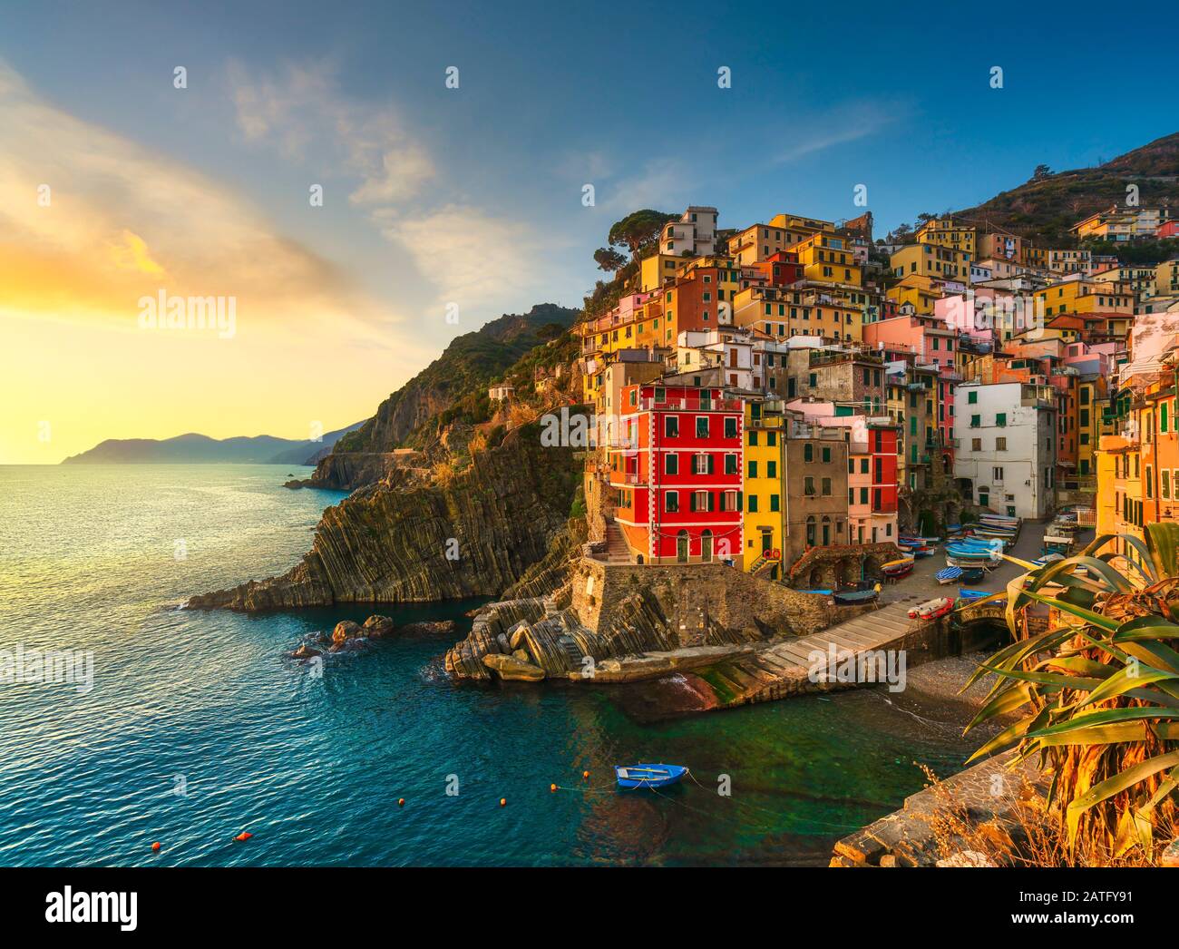 Riomaggiore town, cape and sea landscape at sunset. Seascape in Cinque ...