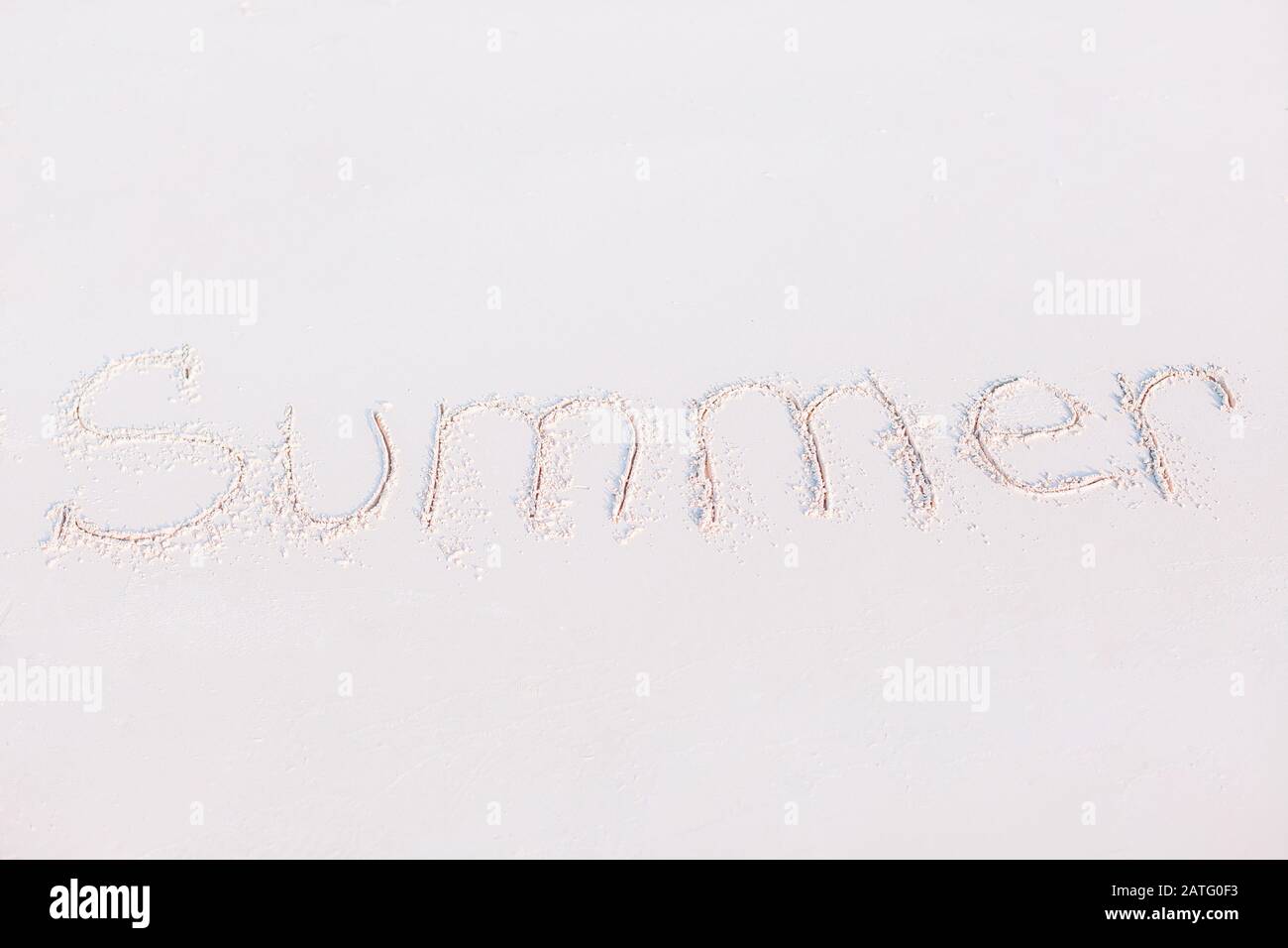 Word Summer handwritten on sand beach with soft ocean wave on ...