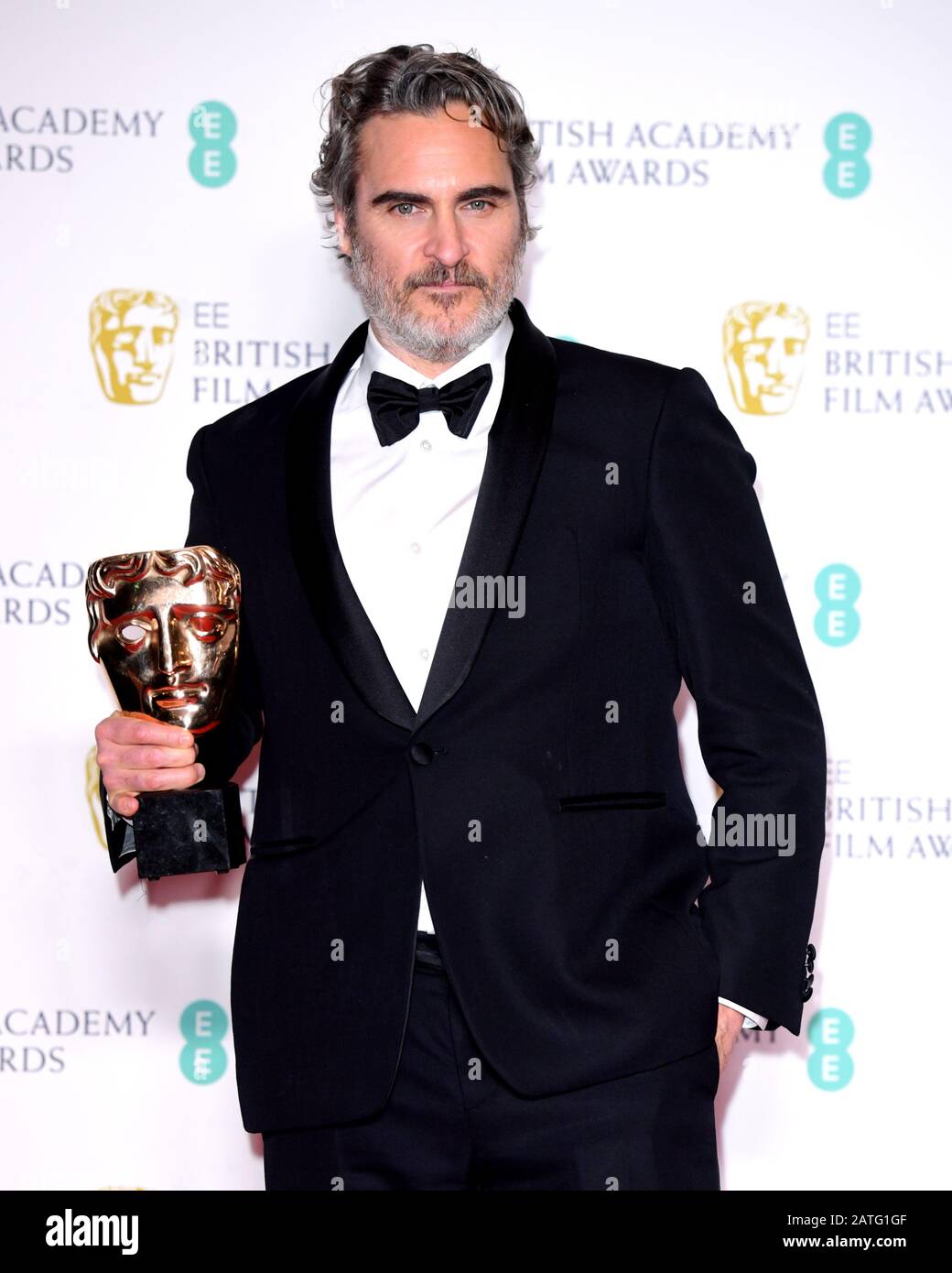 Joaquin Phoenix with his award for Best Actor in the press room at the ...