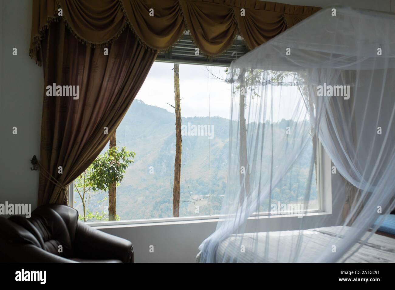 Hotel interior with large panoramic window and view of Mount Stock ...