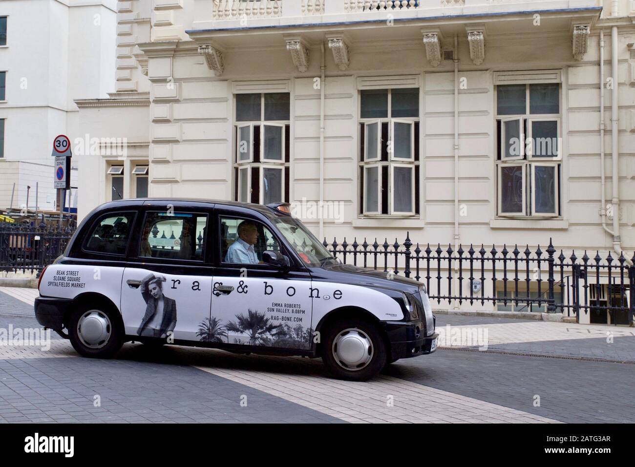 London taxi with advertising hi-res stock photography and images - Alamy