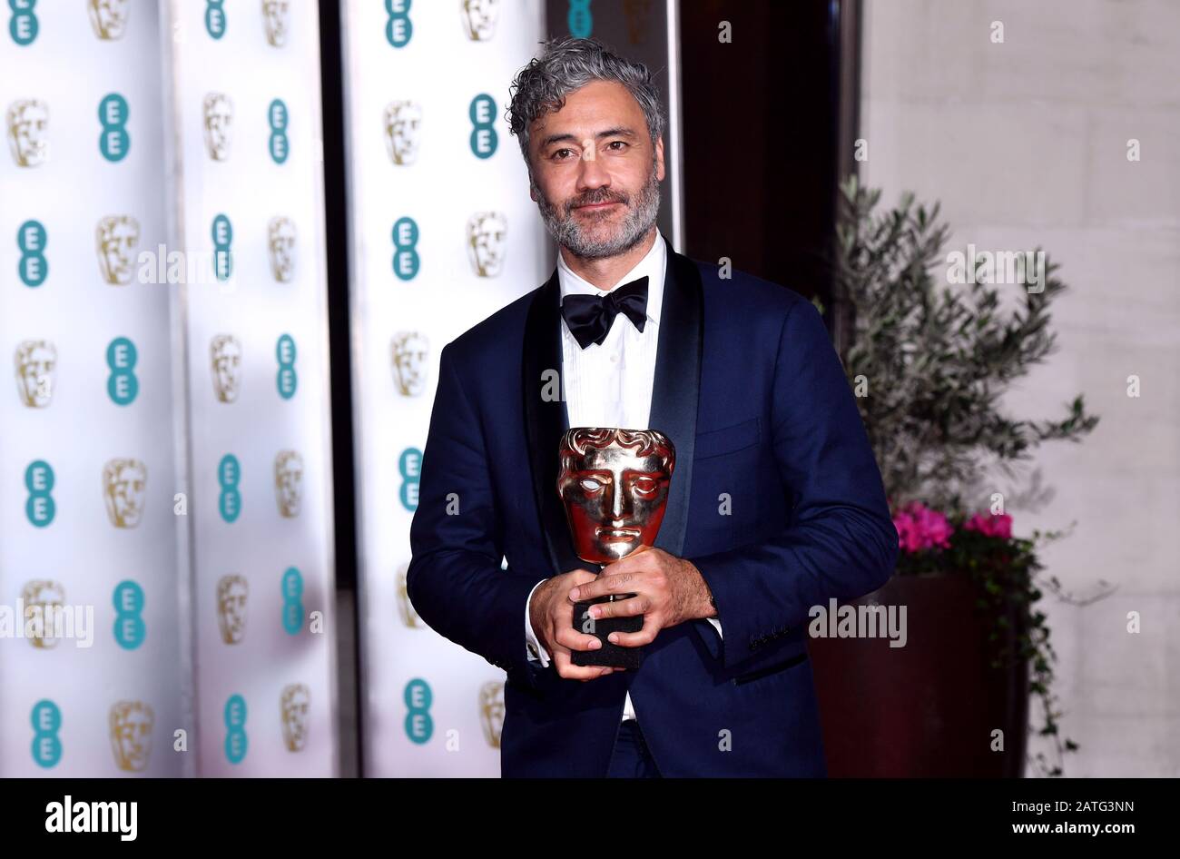 Taika Waititi with his Best Adapted Screenplay Bafta award attending ...