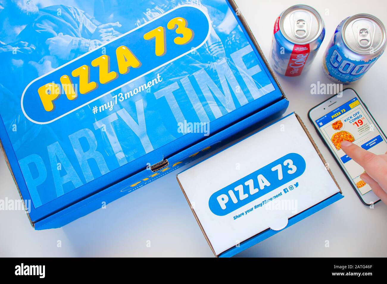 A Pizza 73 Pizza box with wings and a Diet Coke with Nestea pop and ...