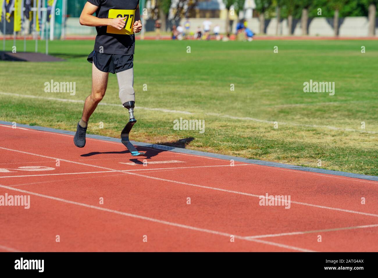 Amputee athlete running on a stadium track Stock Photo - Alamy