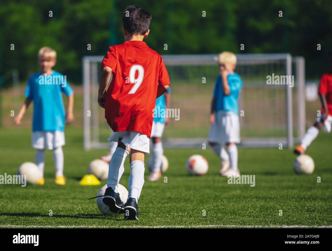 Children Training Soccer on Field. Young Kids Boys kicking Soccer ...