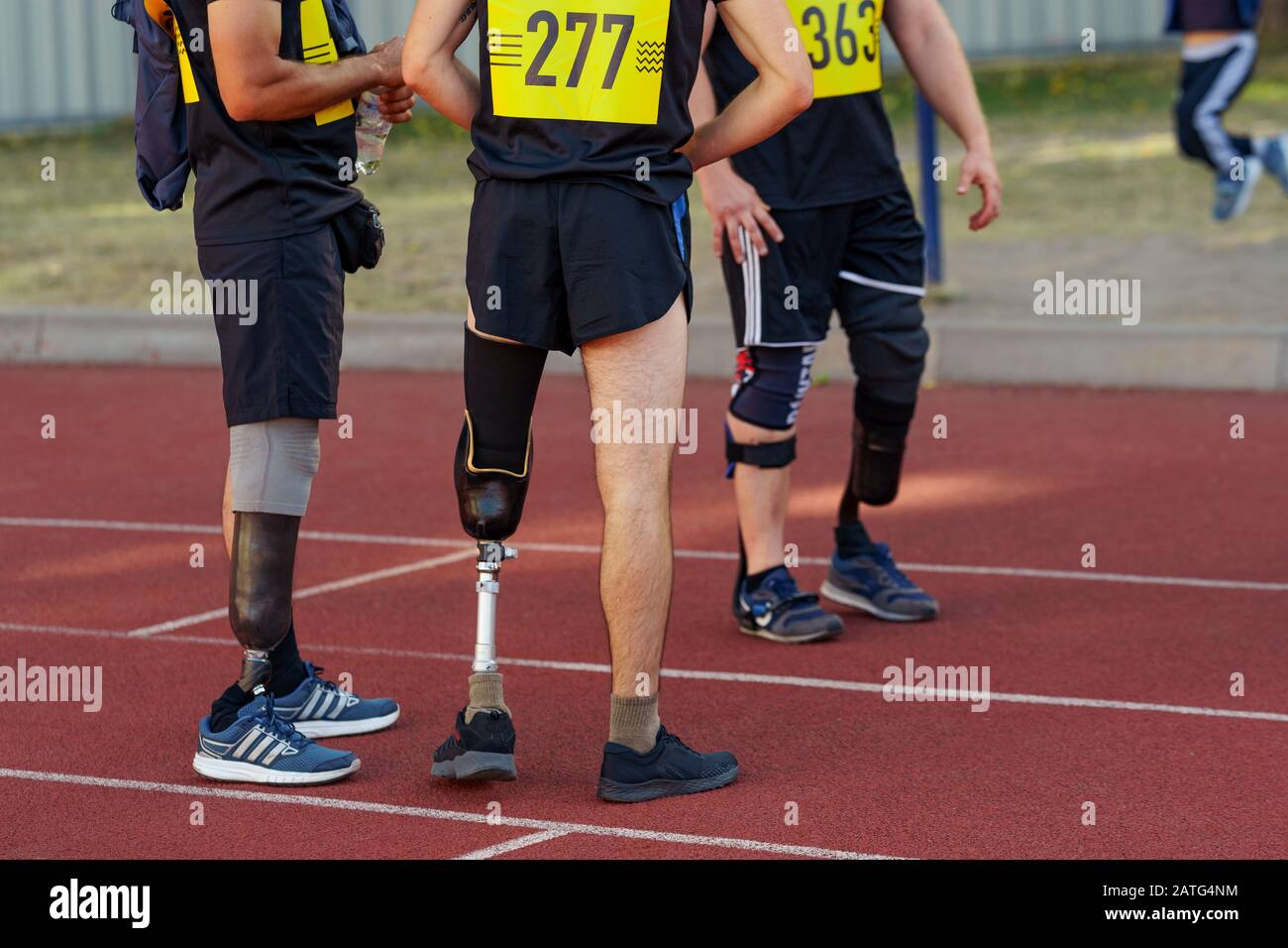 Amputee runners before a race. Low-section shot of sportsmen Stock ...
