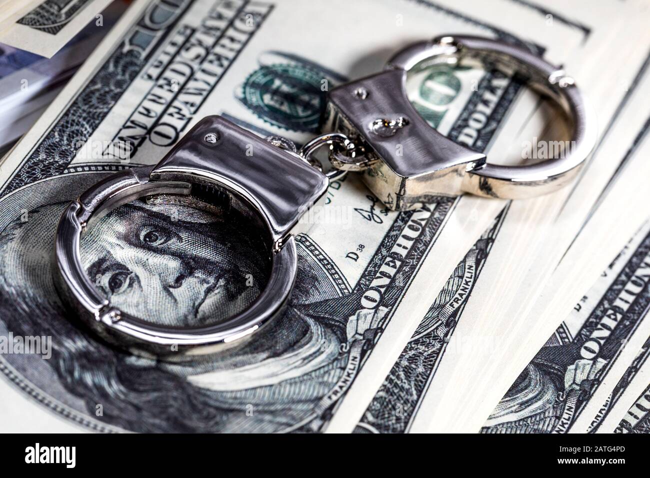 Money handcuffs hi-res stock photography and images - Alamy