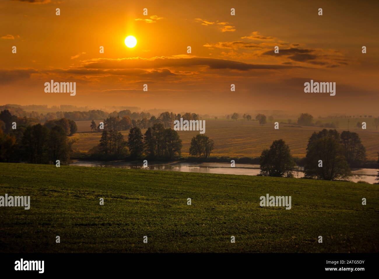 Beautiful sunset over field and forest. Czech Republic. Evening ...