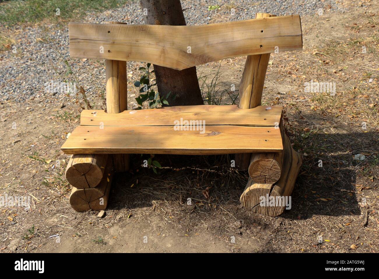 Wooden park bench at a park Stock Photo - Alamy