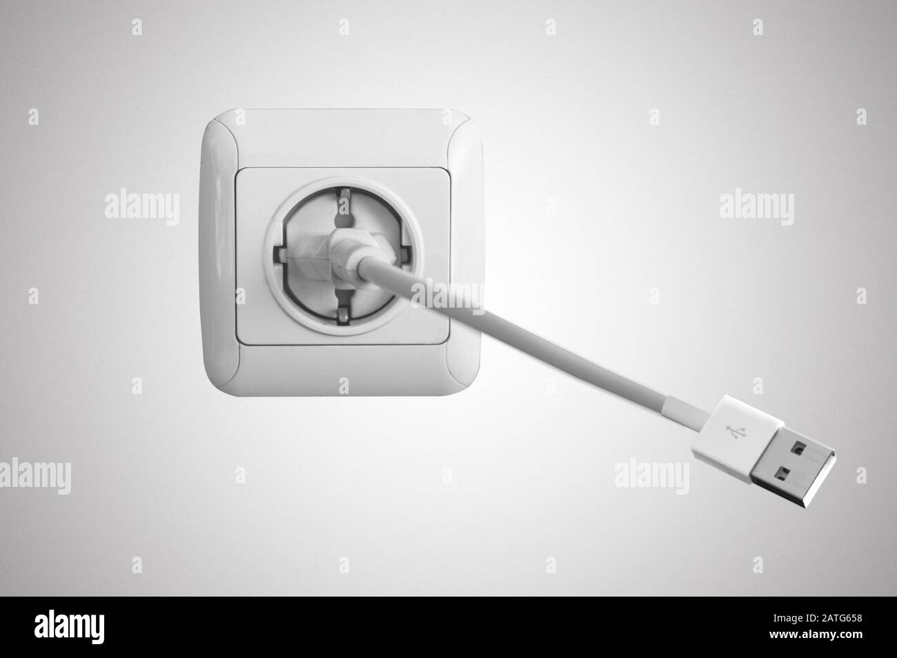 white electric socket on the wall and usb cord Stock Photo - Alamy