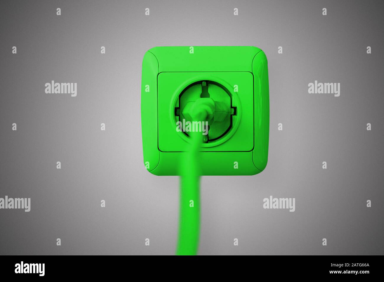 green electric socket on the wall. Close up Stock Photo - Alamy