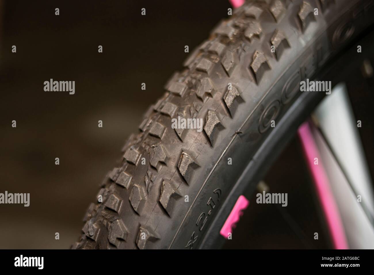 Tread pattern of the wheel of a bicycle in the foreground Stock Photo ...
