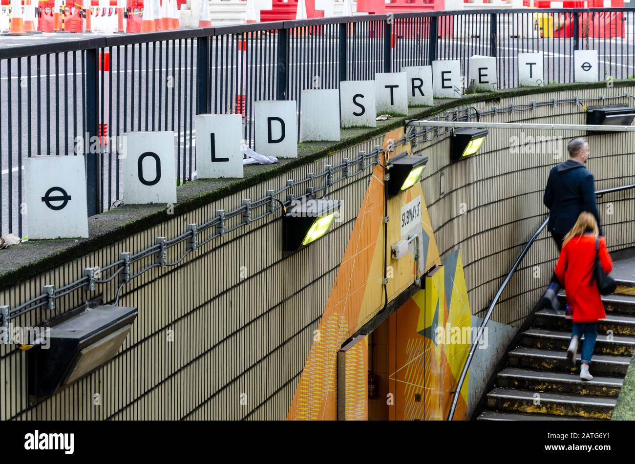 People walking up steps leading up and down to an entrance into Old ...