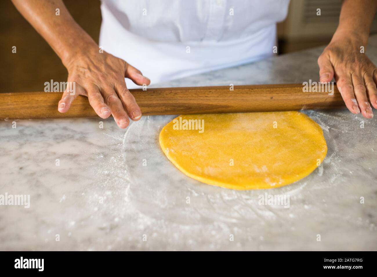 Hands rolling pasta hi-res stock photography and images - Alamy
