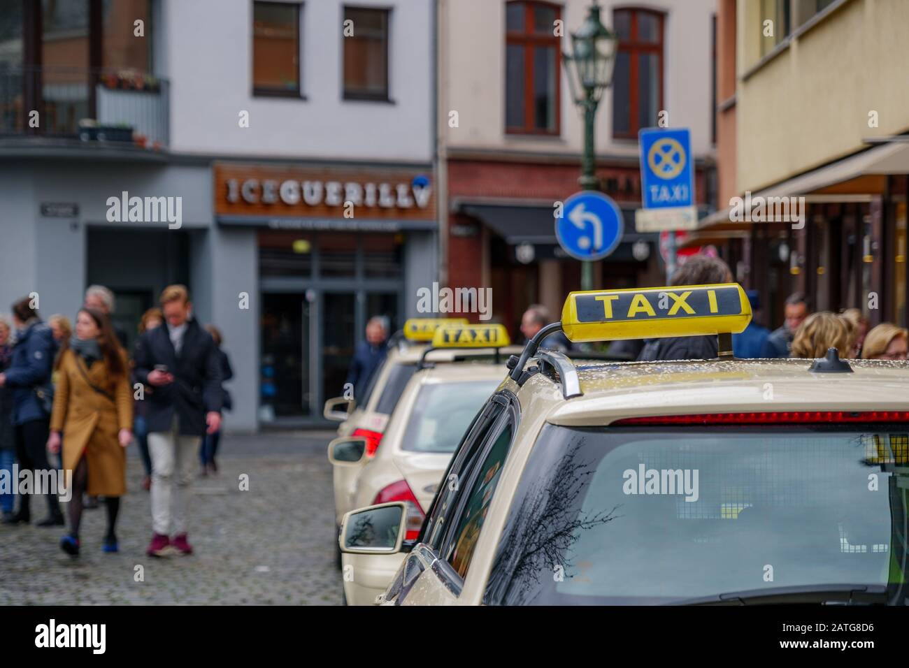 Selected focus at Taxi sign on roof of Taxi yellow cabs park at ...