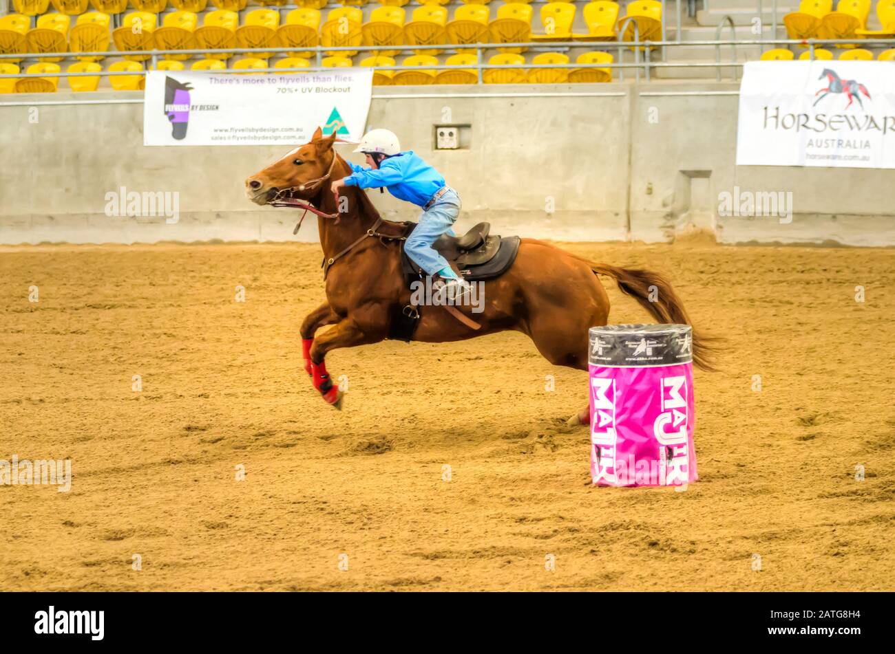 Young rider in a barrel race Stock Photo - Alamy