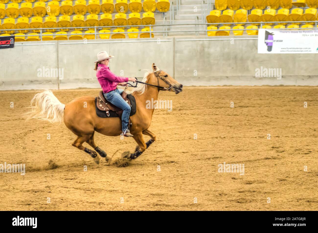 Lady competing in a barrel race Stock Photo - Alamy