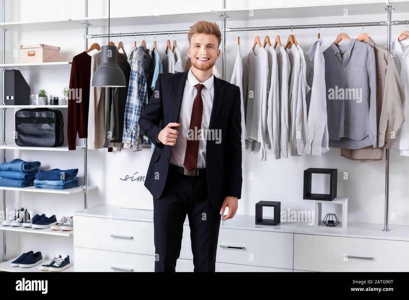 Stylish young man in dressing room Stock Photo - Alamy
