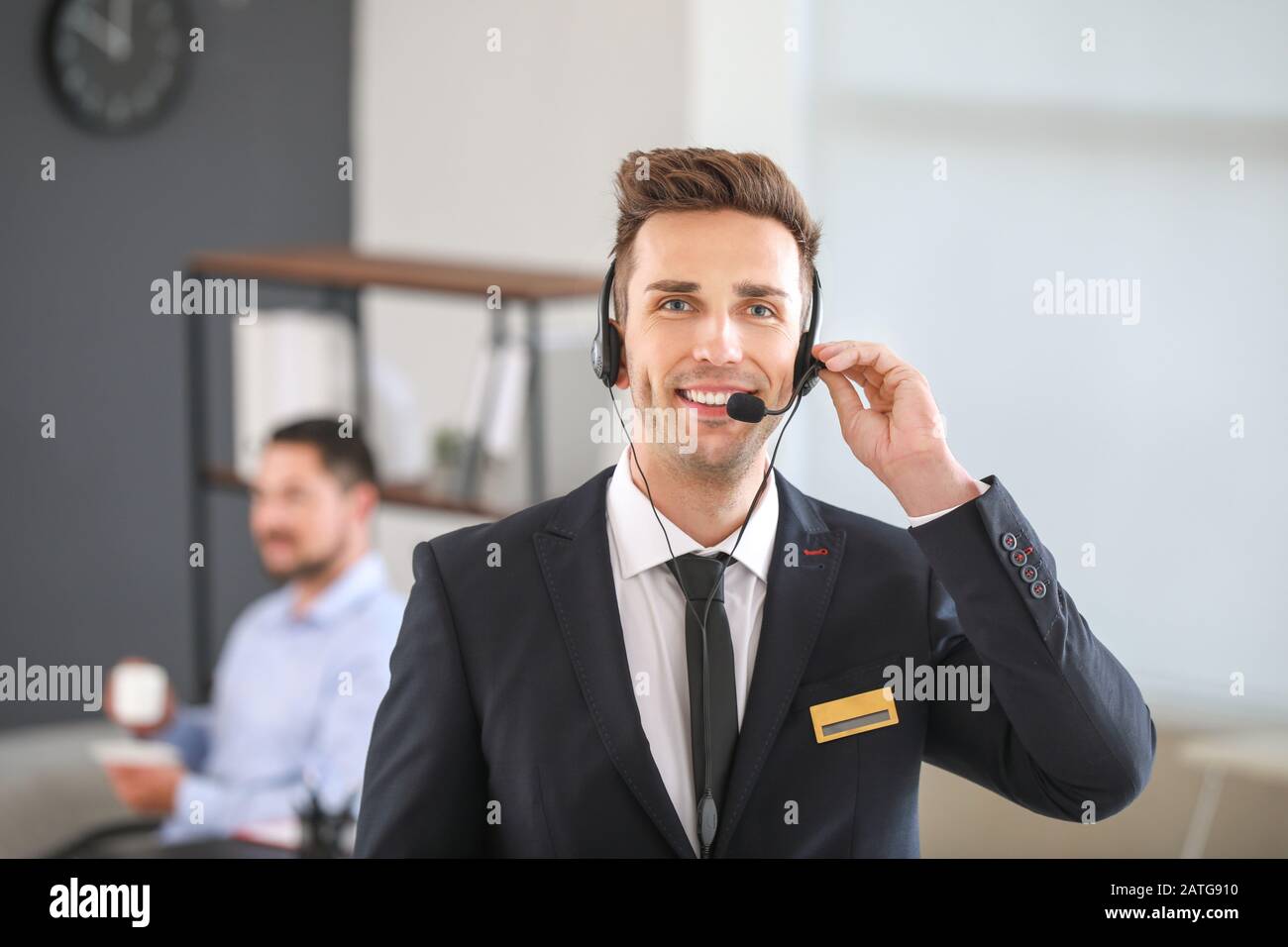 Male office reception desk employee hi-res stock photography and images ...