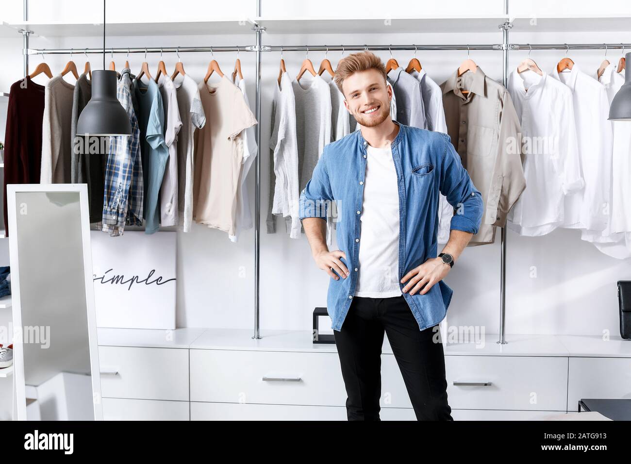 Stylish young man in dressing room Stock Photo - Alamy