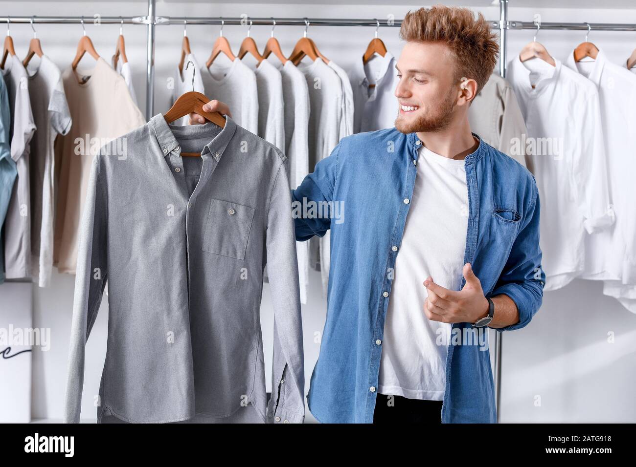 Handsome man with stylish clothes in dressing room Stock Photo - Alamy