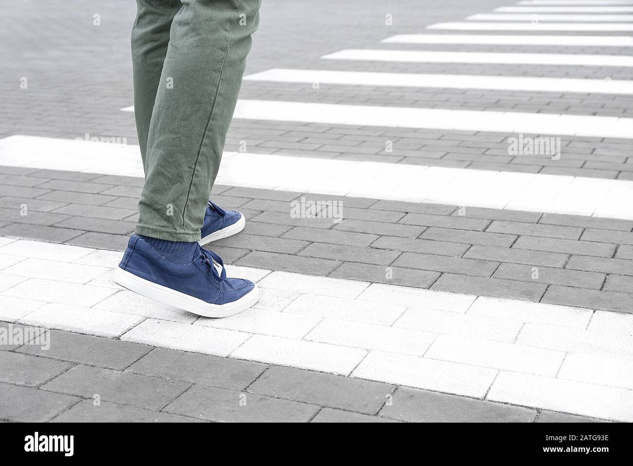 Young man crossing road. Concept of choice Stock Photo - Alamy