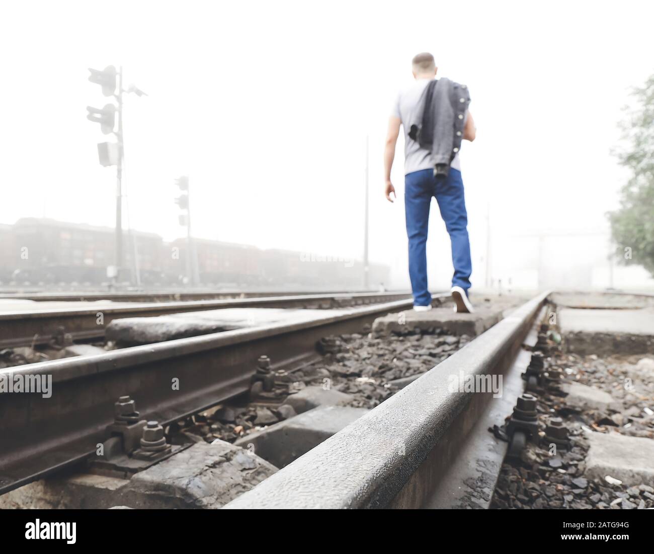 Man walking along railway track hi-res stock photography and images - Alamy
