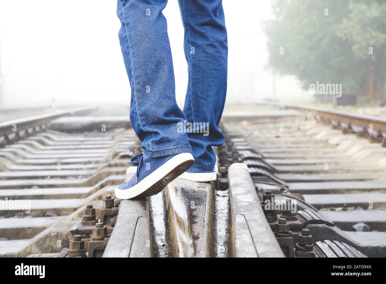 Man walking along railway track hi-res stock photography and images - Alamy