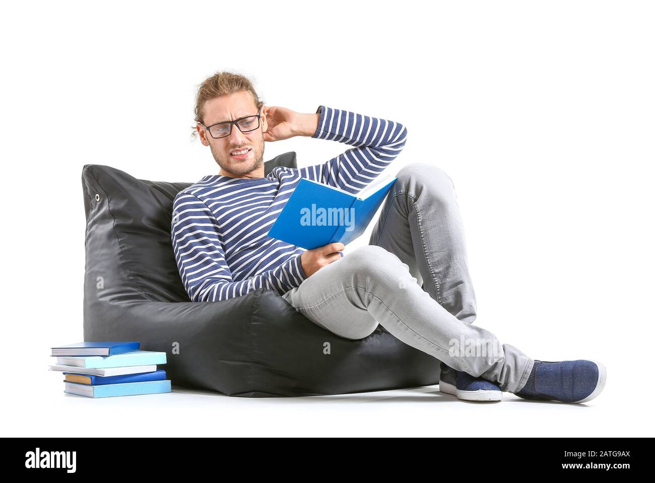 Handsome man reading book on white background Stock Photo - Alamy