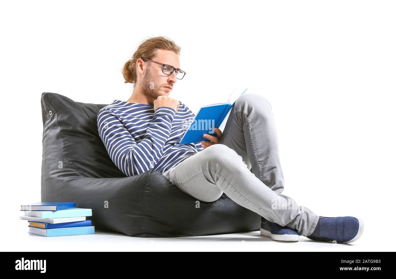 Handsome man reading book on white background Stock Photo - Alamy