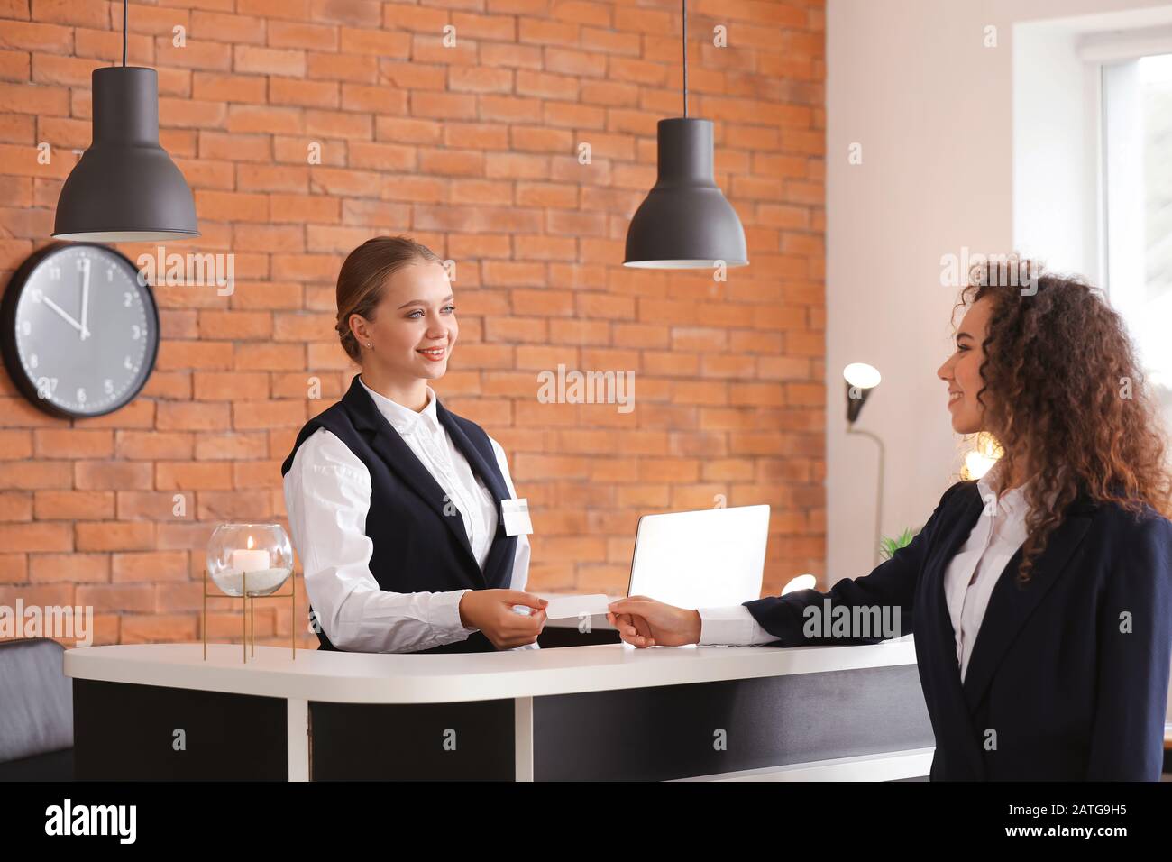 Hotel receptionist african american hi-res stock photography and images ...
