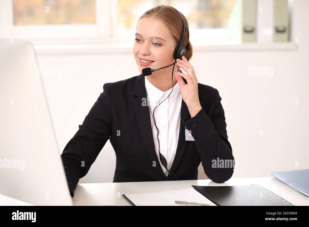 Female secretary working in office Stock Photo - Alamy