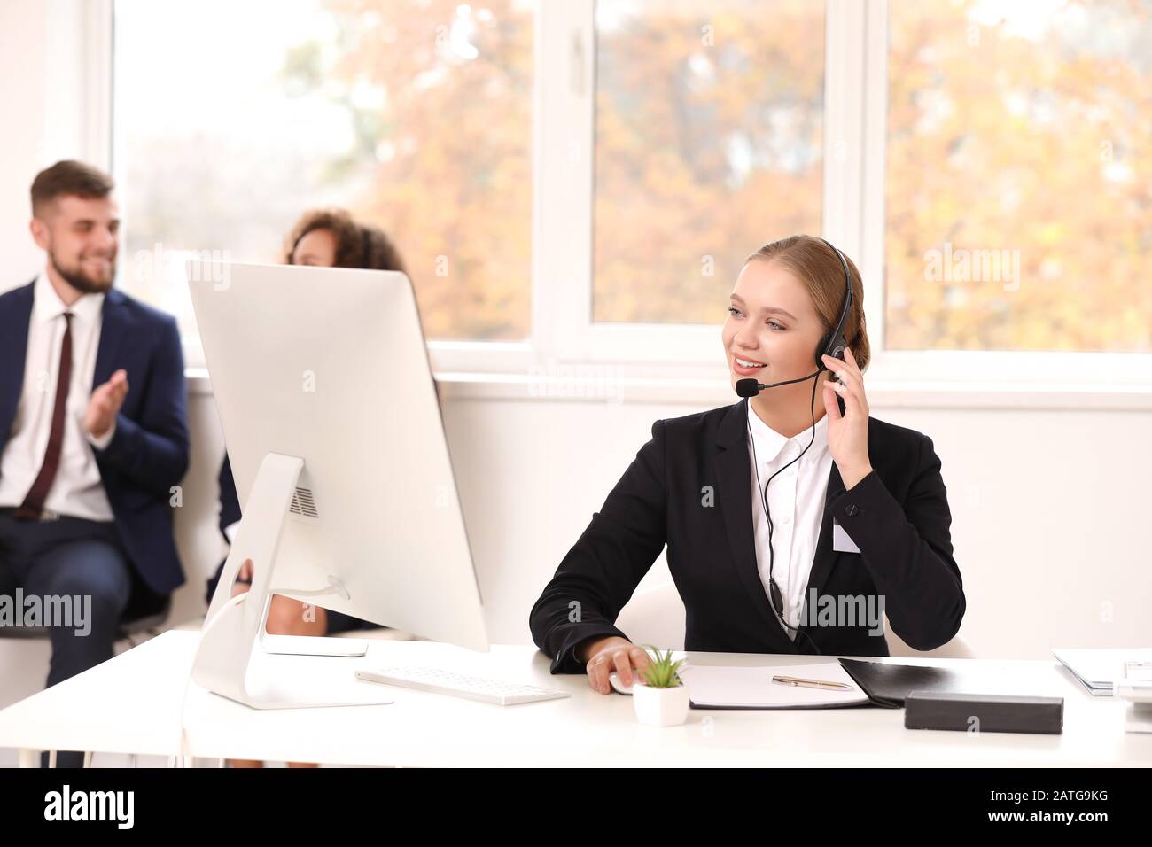 Female secretary working in office Stock Photo - Alamy