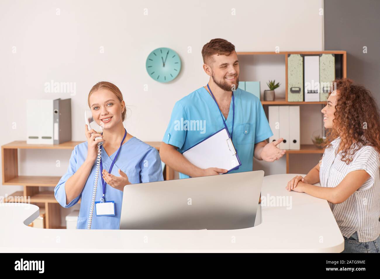 Female male receptionists working hi-res stock photography and images ...