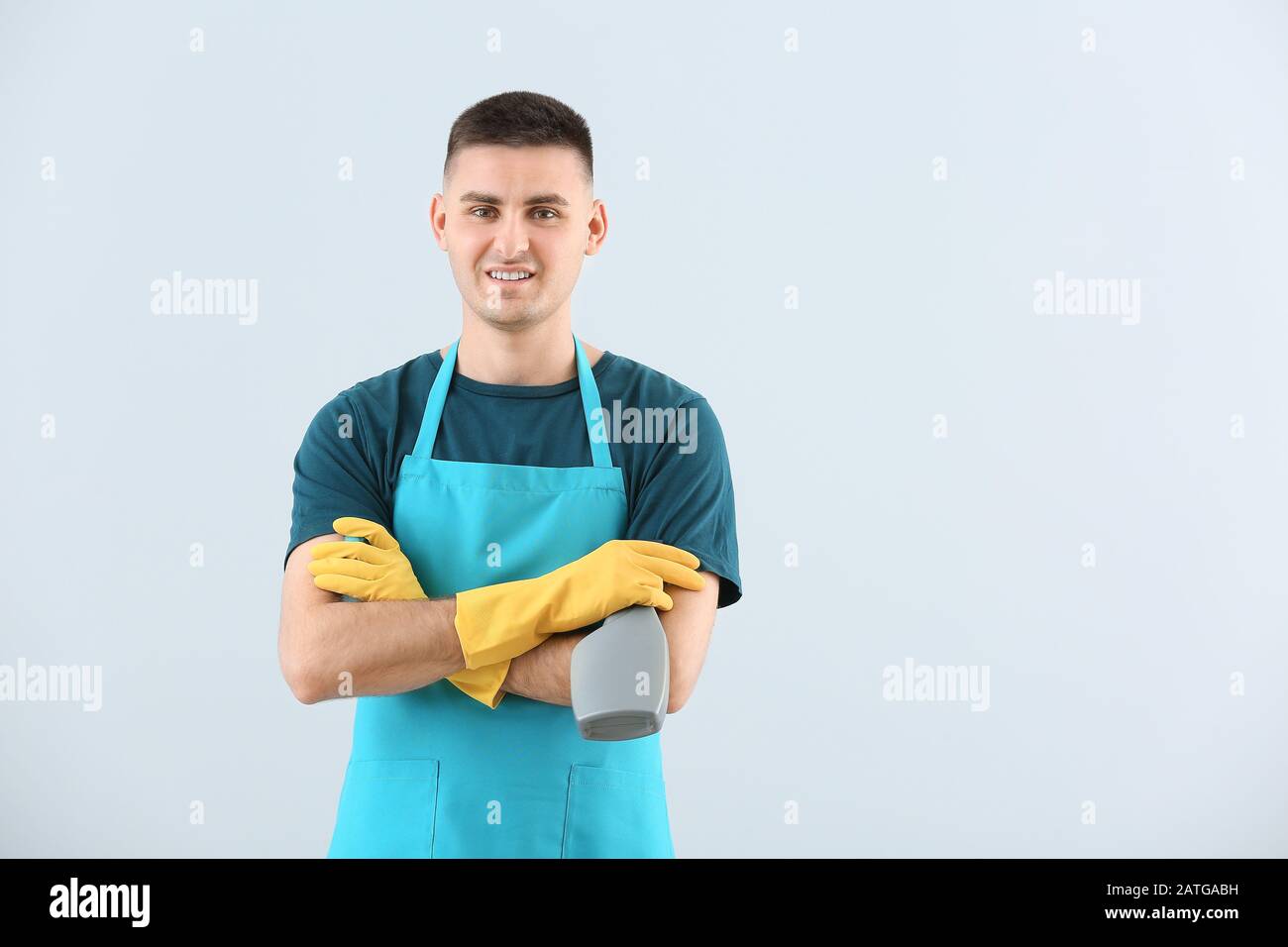 Portrait of janitor on light background Stock Photo - Alamy