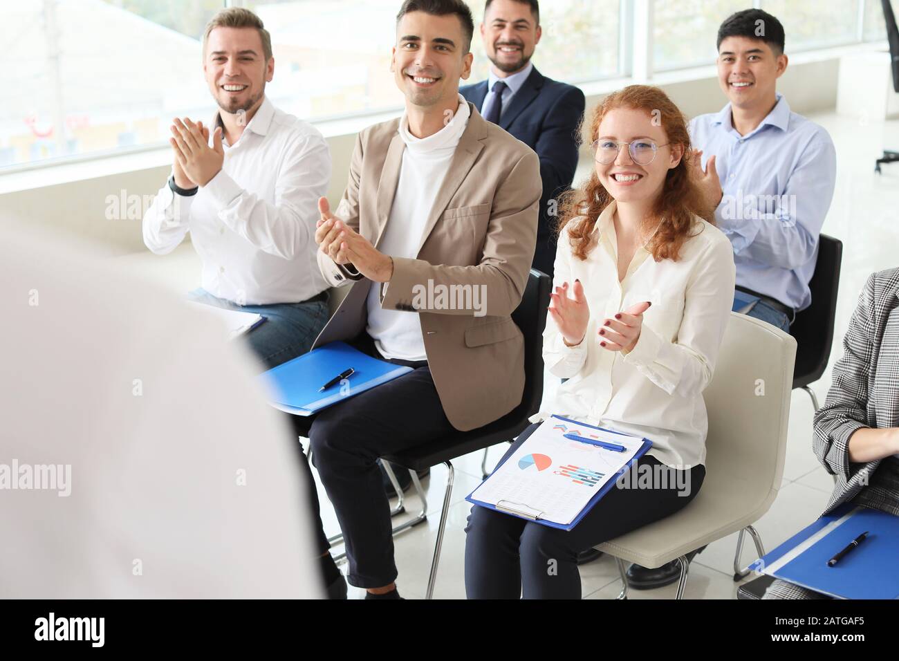 Group of happy business people during training in office Stock Photo ...