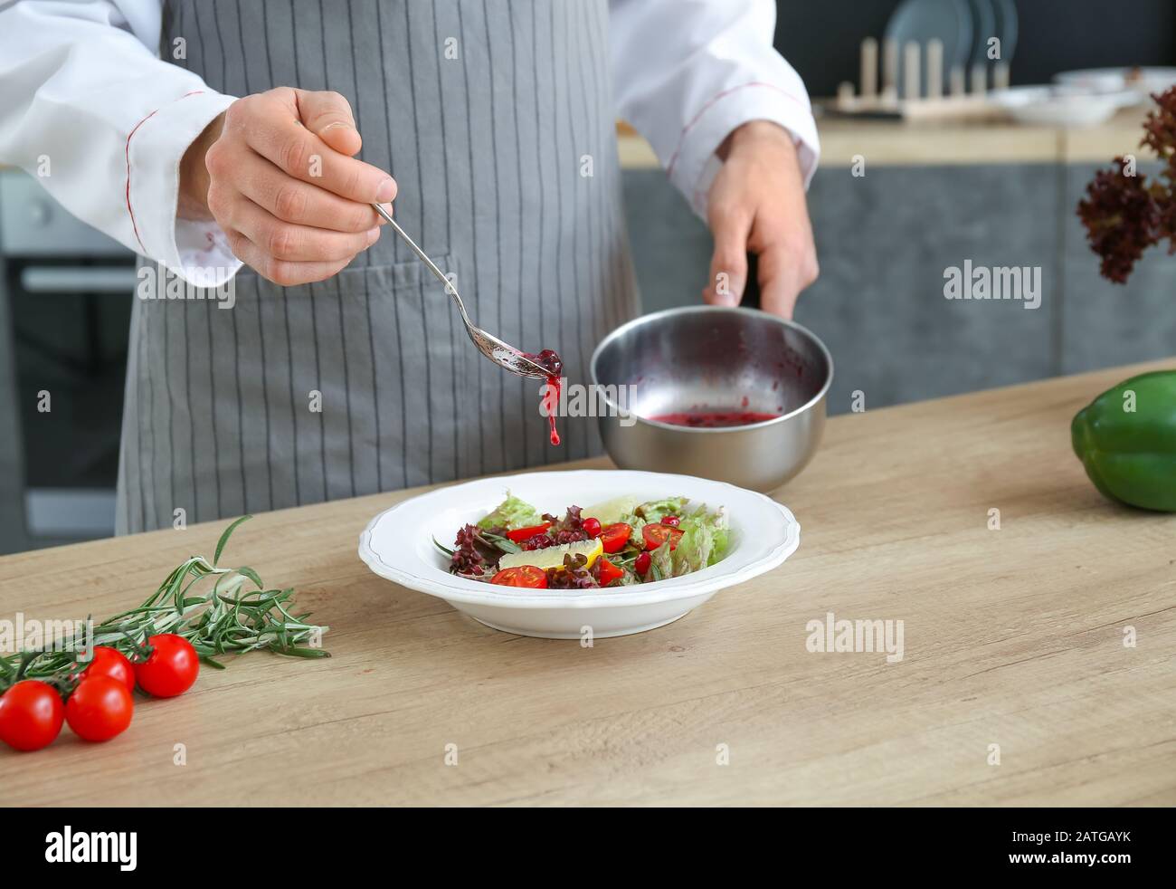 Male chef cooking in kitchen, closeup Stock Photo - Alamy