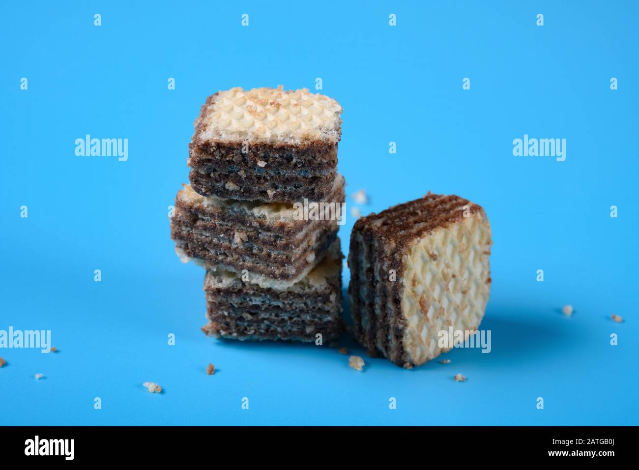 chocolate wafer blocks on a blue background Stock Photo - Alamy