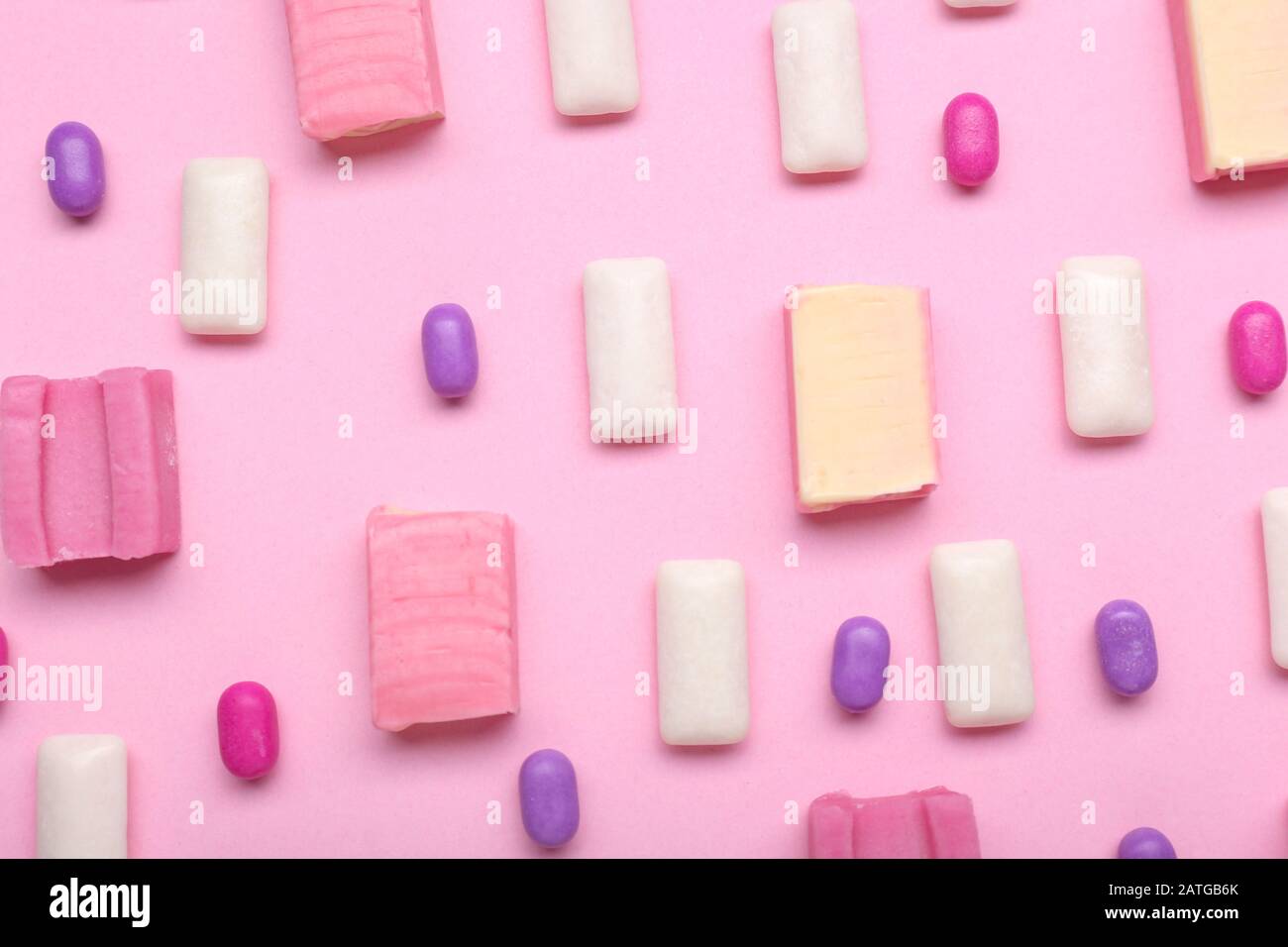 Different chewing gums on color background Stock Photo - Alamy